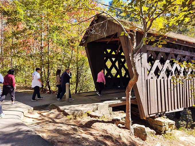 Fall colors frame the bridge perfectly, creating a scene so picturesque it almost doesn't look real but absolutely is.