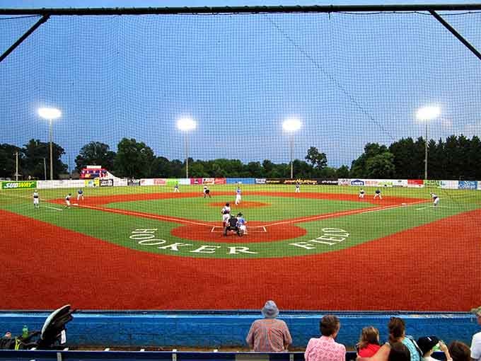 Hooker Field under twilight skies&mdash;where America's pastime feels timeless. The crack of the bat here sounds just as sweet as at any major league park.