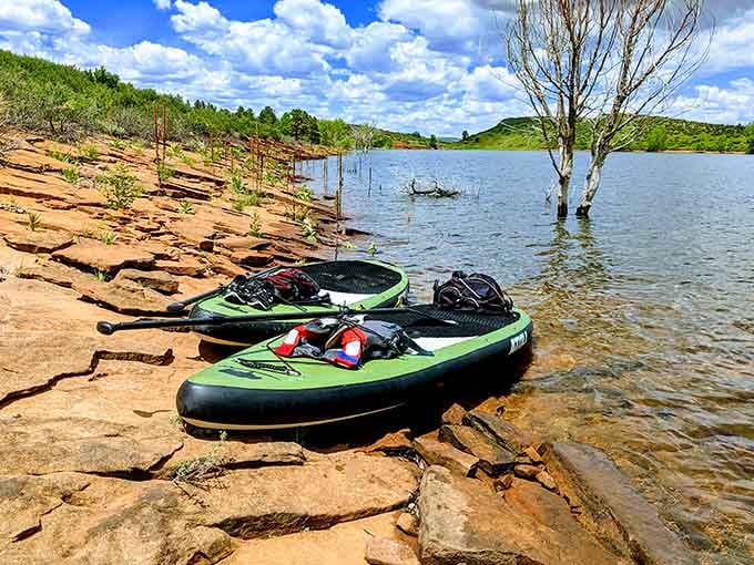 Paddleboards waiting patiently at the shoreline—your ticket to exploring Horsetooth Reservoir's hidden coves and peaceful waters.