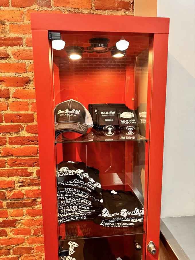 Merchandise displayed like treasures because wearing your cheesesteak loyalty on your sleeve is perfectly acceptable behavior here.