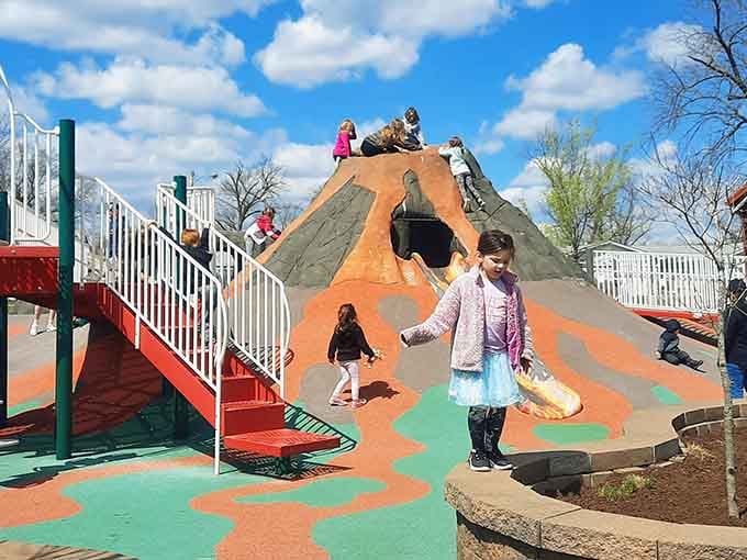 The volcano slide offers multiple routes down, because variety is the spice of playground life, my friends.