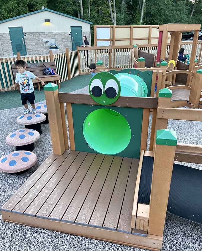 That friendly caterpillar tunnel beckons young explorers to crawl through and discover what adventures await inside its belly.