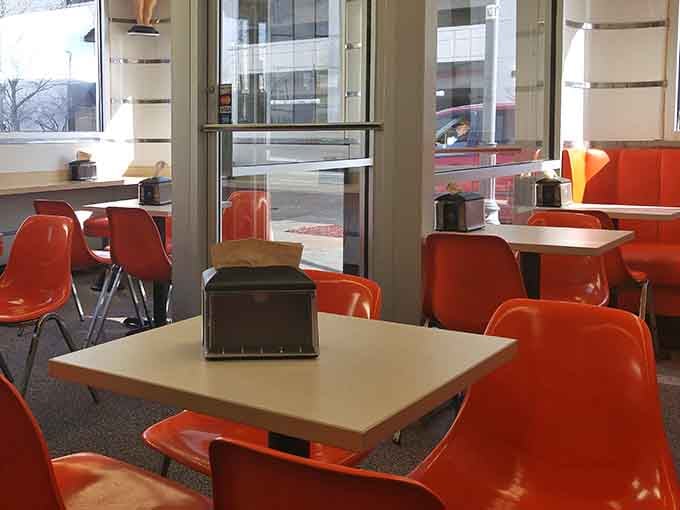 Bright orange seating and big windows create the perfect spot for people-watching while burger-munching in downtown Lima.