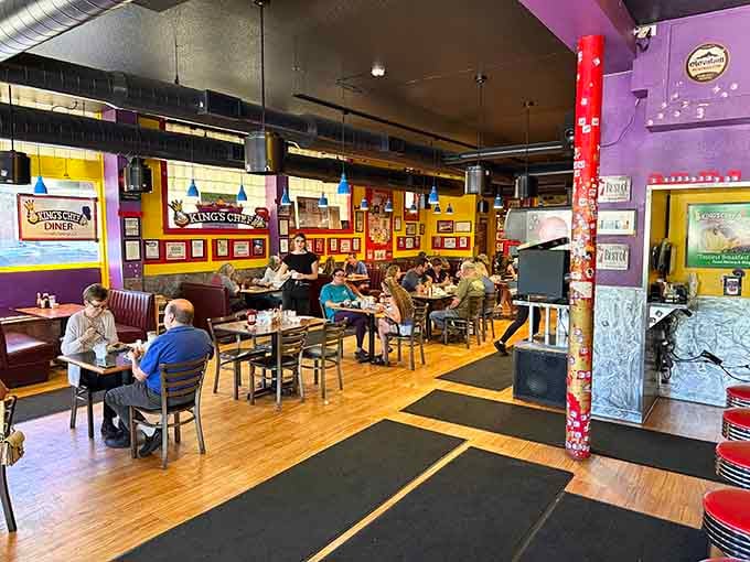 Real people enjoying real breakfast in a space that feels like your favorite neighbor's kitchen went wonderfully wild.