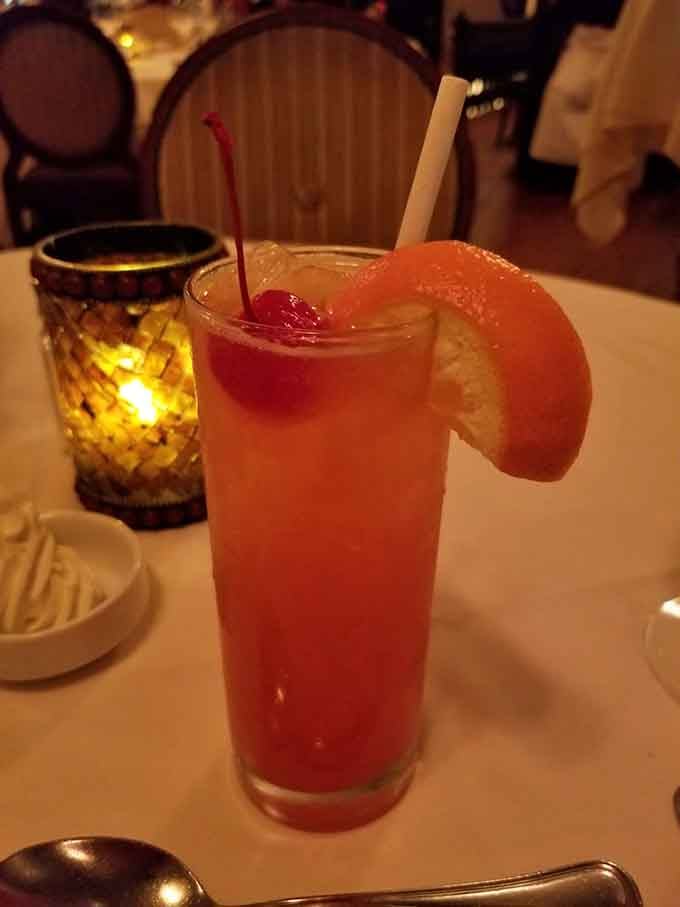 The Prosperity Punch arrives looking like summer vacation in a glass, complete with a grapefruit slice for dramatic effect.