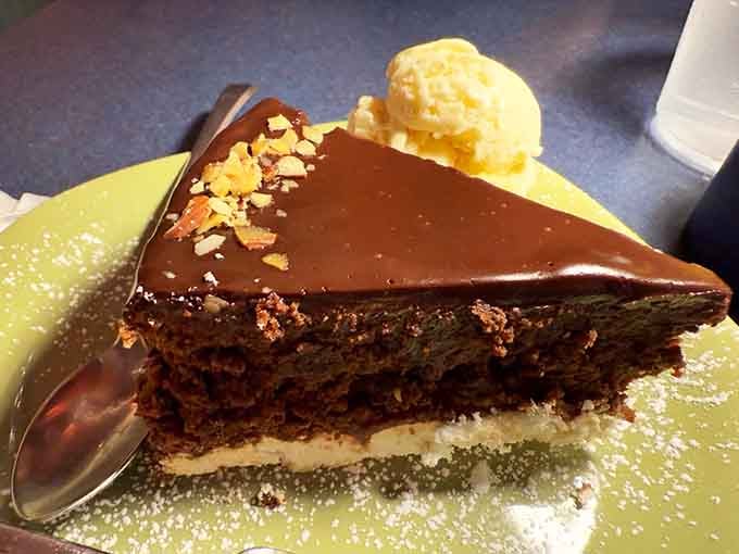 Chocolate torte with a glossy ganache top that's basically asking you to forget about sharing and claim it.