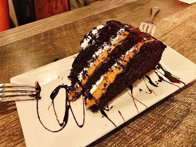 Chocolate cake layered with caramel that looks like it belongs in a dessert hall of fame.