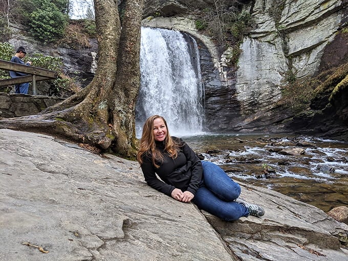 That smile says it all: finding a waterfall this spectacular without earning a hiking merit badge first.