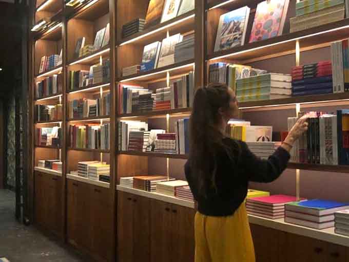 When browsing books becomes a full-contact sport that requires proper wine accompaniment and comfortable shoes for the journey.