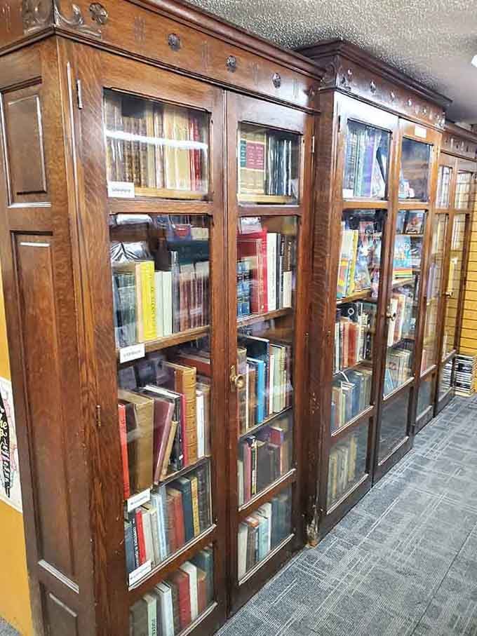 Antique glass cabinets protect rare volumes the way Fort Knox guards gold, but with better reading material.