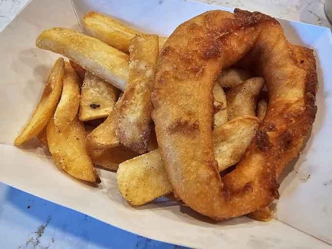 That onion ring is larger than some people's life goals, and honestly, we're here for it every single time.