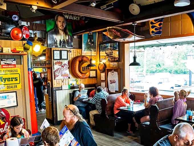 Diners surrounded by visual chaos, happily focused on the delicious order at hand before them.