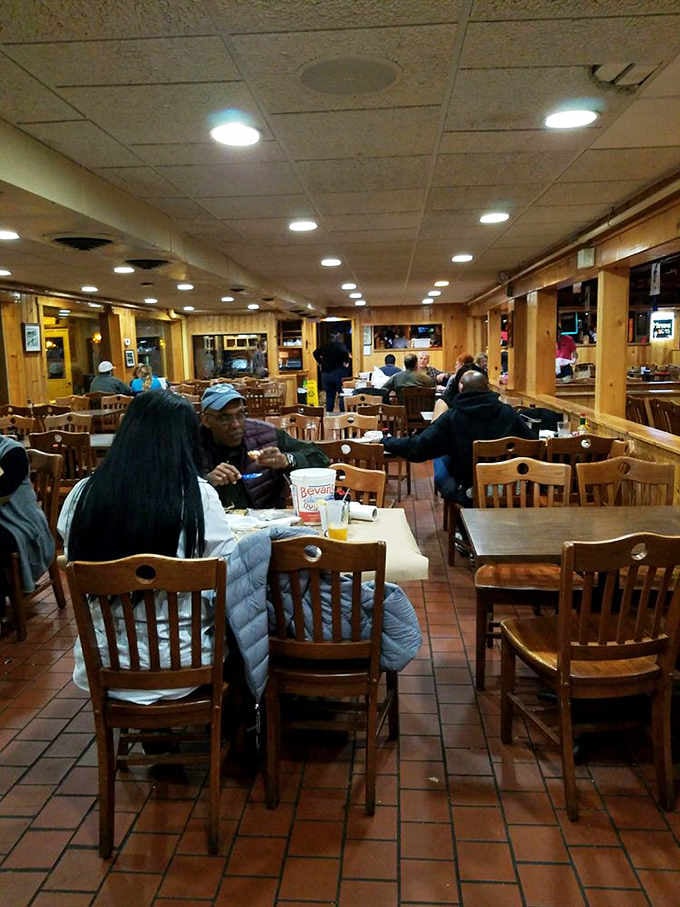 Happy diners in their natural habitat, surrounded by wood paneling and the promise of good seafood.