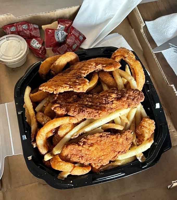 The combination basket delivers cheese curds, chicken tenders, and fries in one glorious tribute to Wisconsin comfort food.