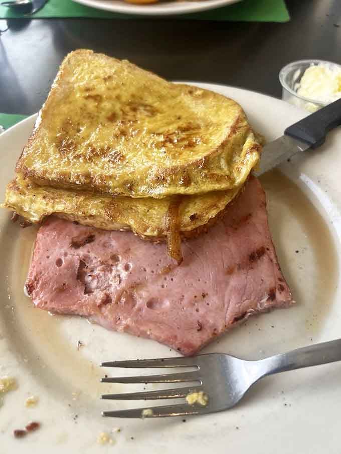 Thick-cut French toast paired with ham, proving breakfast doesn't have to choose between sweet and savory.