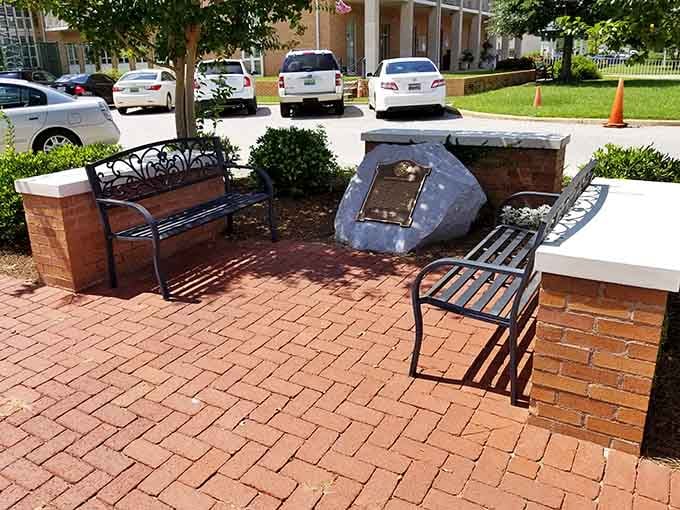 Memorial benches and plaques honor local heroes in this quiet corner where history meets gratitude and reflection.