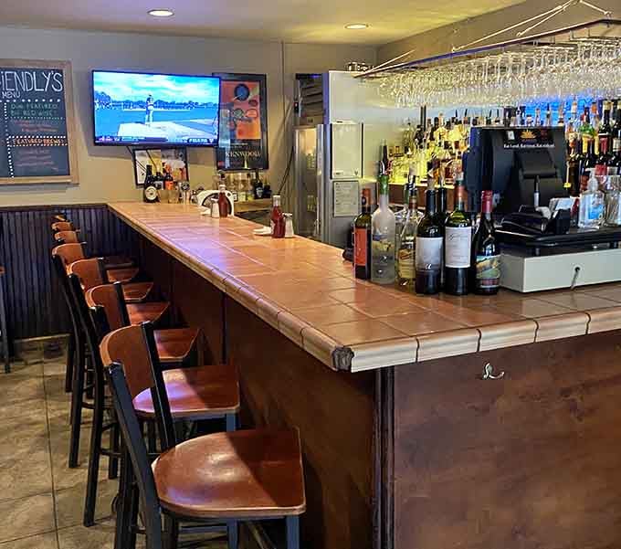 The bar area invites you to pull up a stool and settle in for conversation, cold drinks, and excellent food.
