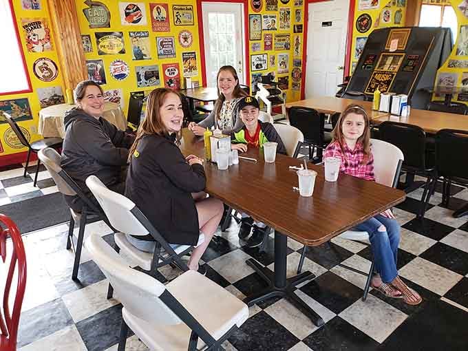Families gathering around tables covered in vintage memorabilia, sharing root beer and stories, that's the real menu item here.