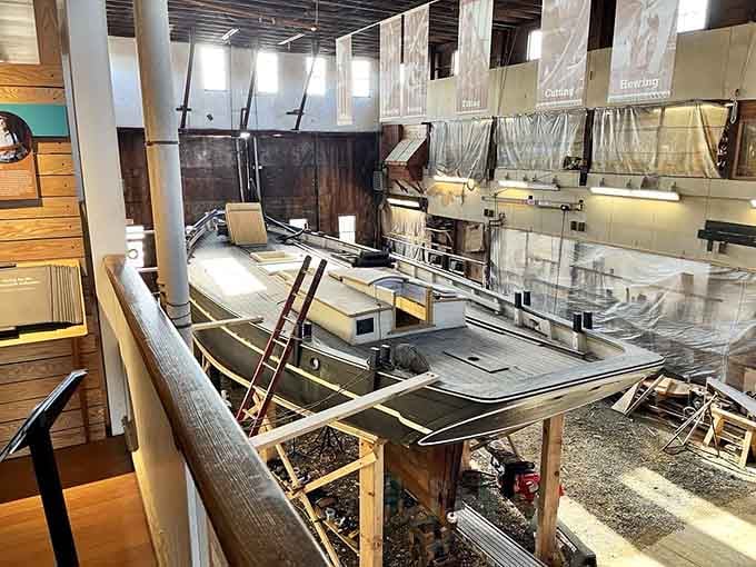 Inside the restoration workshop, boat skeletons await their rebirth, surrounded by tools and techniques from another era entirely.
