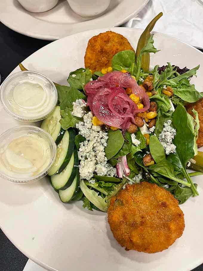 Fresh greens topped with pickled onions and golden fried green tomatoes make salad feel like a celebration.