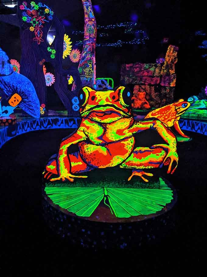 A neon frog prince waiting for someone to sink that perfect putt and break the spell.
