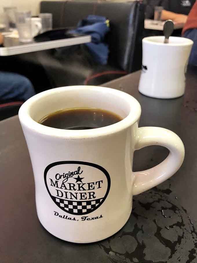 Classic diner coffee in a branded mug tastes better than fancy espresso when you're seeking authentic American breakfast vibes.
