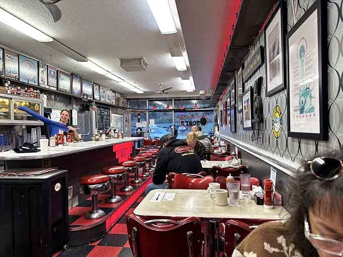 The counter seats offer front-row tickets to the breakfast show, where every order is opening night on Broadway.