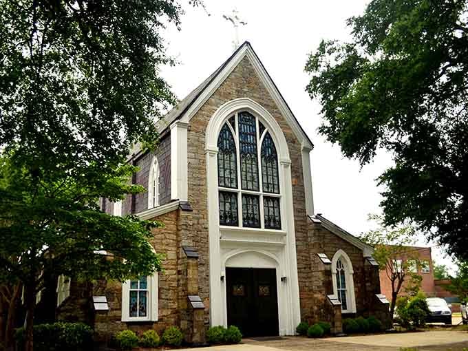 Sunlight through stained glass creates a kaleidoscope of colors inside this stone sanctuary. Where faith and architectural beauty have a standing weekly appointment.