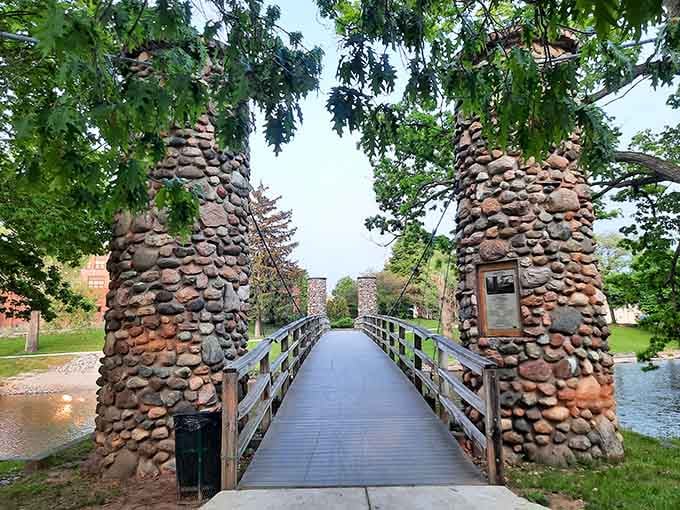 Cross this charming stone-pillared bridge and enter a world where literary history meets small-town Michigan charm beautifully.