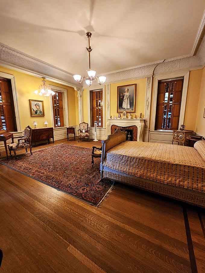 A bedroom where the wicker furniture somehow costs more than your entire living room set back home.