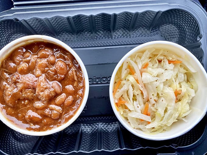 Baked beans loaded with meat and creamy slaw: the supporting actors that deserve their own standing ovation.