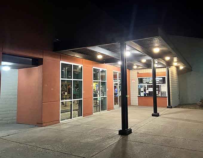 The Pelican Cinema glows with evening promise &ndash; where small-town movie magic happens without big-city ticket prices.