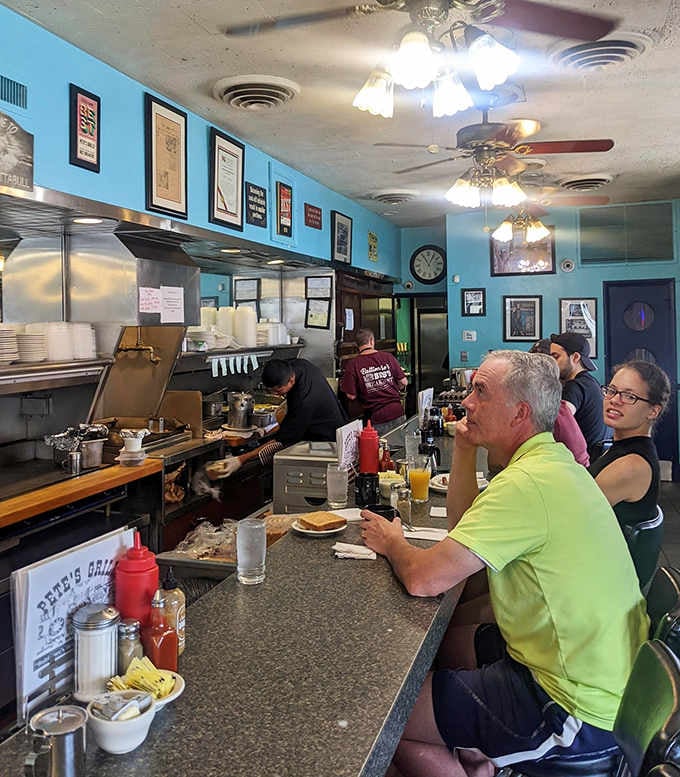 The counter fills with happy faces, proof that great breakfast brings the whole neighborhood together every single morning.