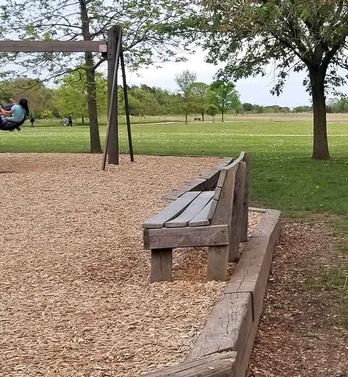Sturdy benches offering front-row seats to childhood magic, where parents can rest while kids conquer their personal Everests.