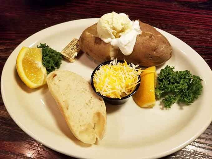 Everything you need on one plate: fluffy potato, crusty bread, melted butter, and a side of pure comfort.