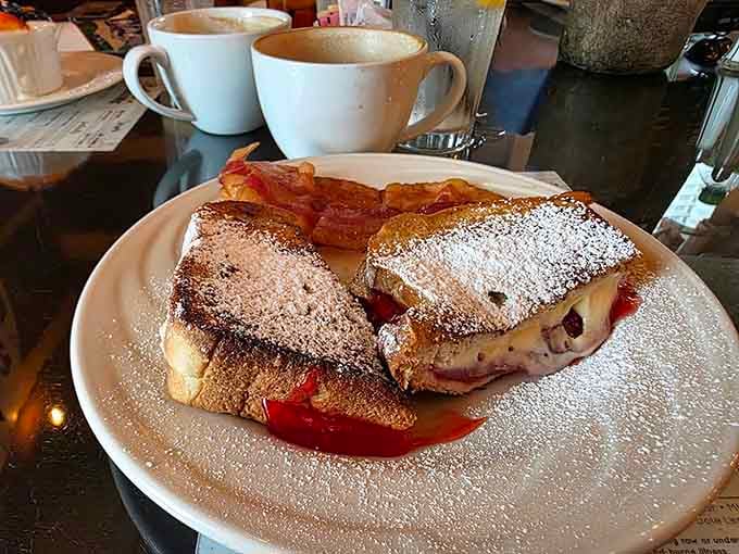 French toast dusted with powdered sugar and served with bacon, because some mornings demand a little extra celebration.