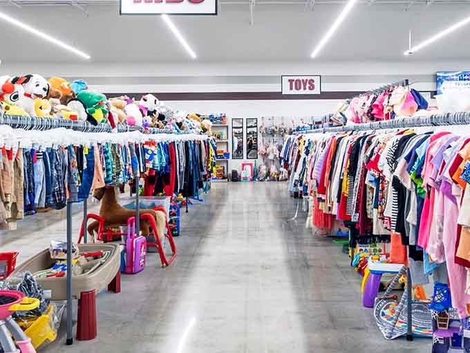 The kids' section where toys and tiny clothes prove that children outgrow things faster than anyone can believe.