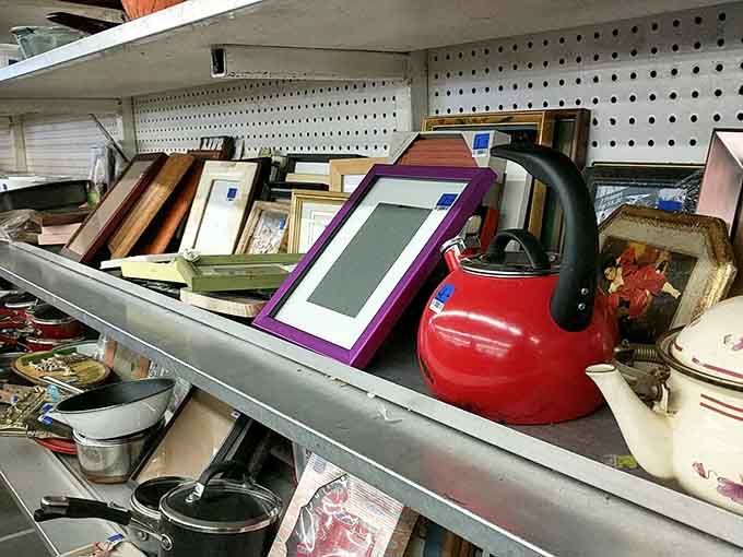 That bright red teakettle nestled among empty frames proves you never know what combinations await discovery.