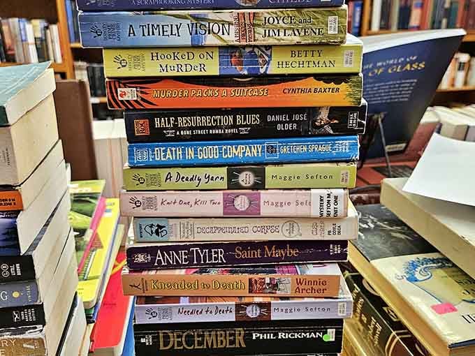 Mystery novels stacked high remind you that the real mystery is how you'll carry them all home.