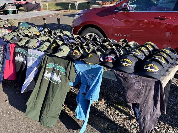 Baseball caps lined up like soldiers, ready to protect your head from sun while broadcasting your allegiances to strangers.