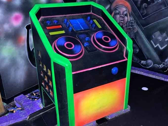 Turntables and speakers create obstacles that look ready to drop the beat right onto your golf ball's path.