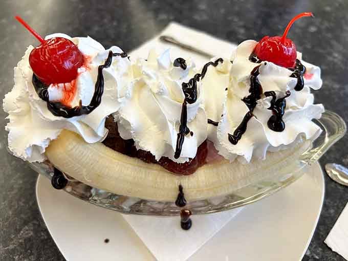 The banana split arrives looking like it escaped from a Norman Rockwell painting, complete with cherry on top.