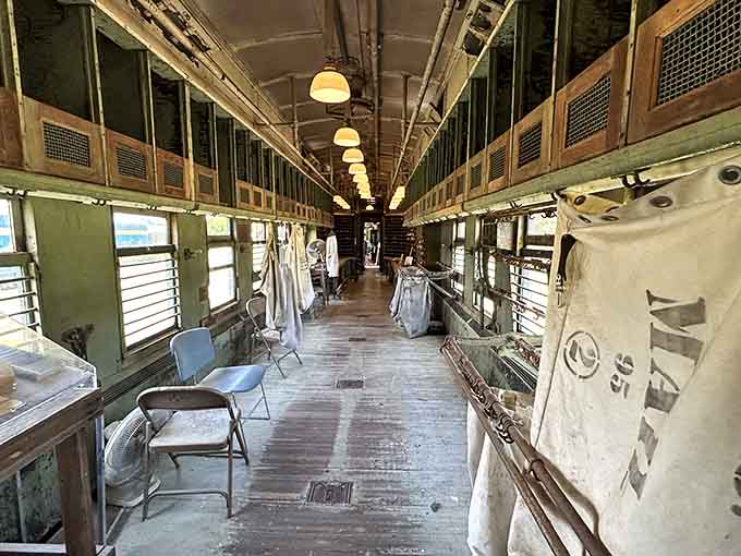 Inside a Railway Post Office car where mail was sorted at speed, back when "express delivery" meant something entirely different.