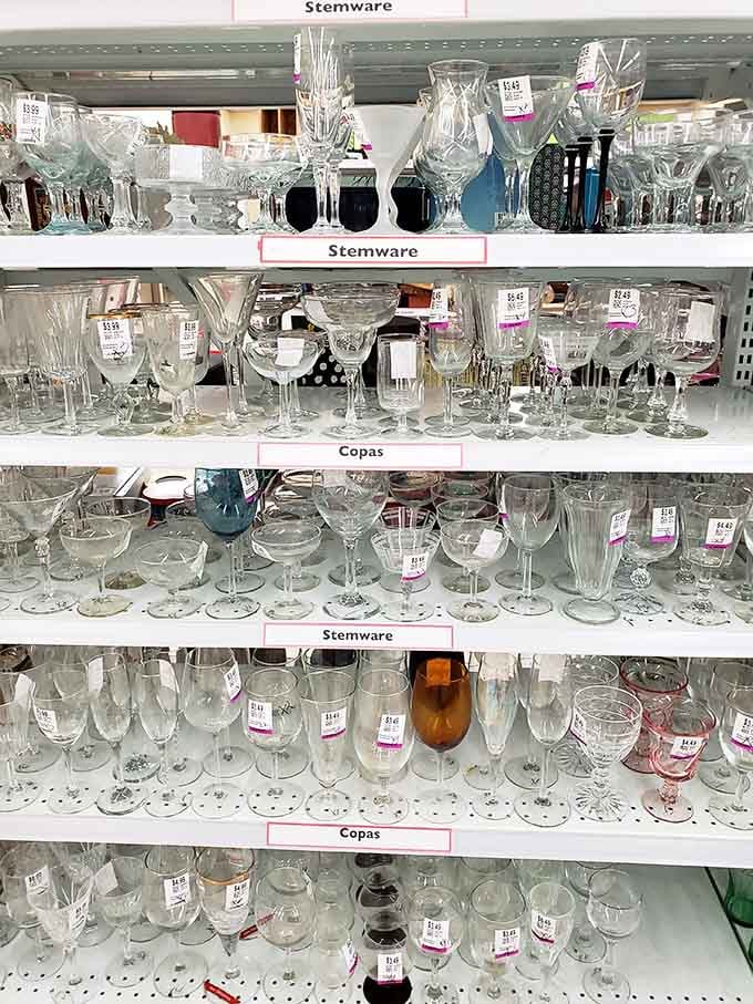 Stemware and glassware gleam on shelves, perfect for hosting without the department store price tag.