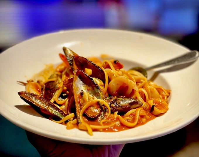 Seafood linguine that would make an Italian grandmother nod in approval—those mussels aren't just fresh, they're practically still singing sea shanties.
