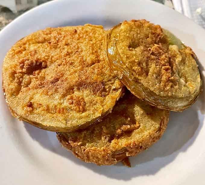 Fried green tomatoes with a cornmeal crust so perfect, they could make a Southerner weep tears of pure joy.