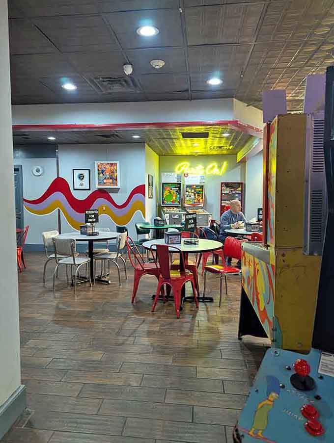 Colorful mid-century modern seating areas provide the perfect spot to catch your breath between epic games.