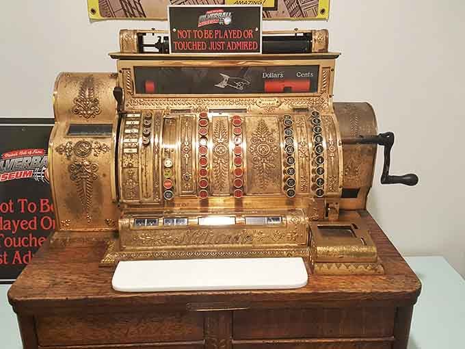 An ornate vintage cash register that's seen more transactions than your credit card, back when quarters were actual currency.