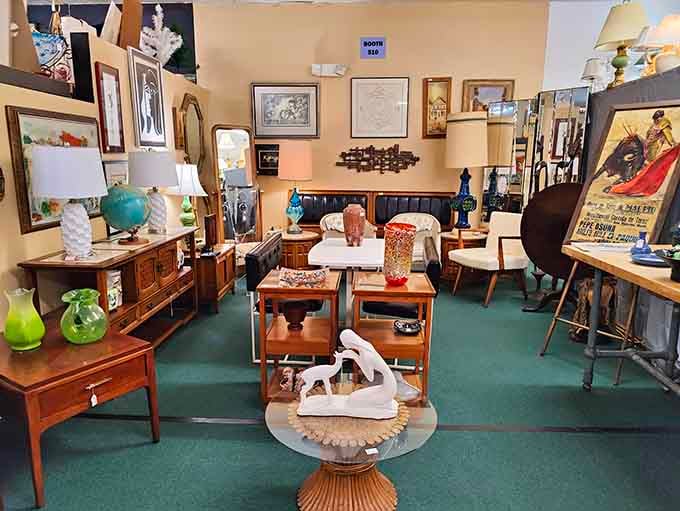 Mid-century furniture arranged like a living room time capsule, complete with globe and vintage artwork galore.