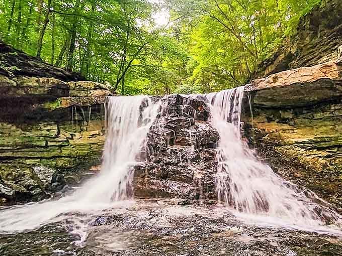 This waterfall cascades over limestone ledges year-round, freezing into ice sculptures come winter that defy belief.